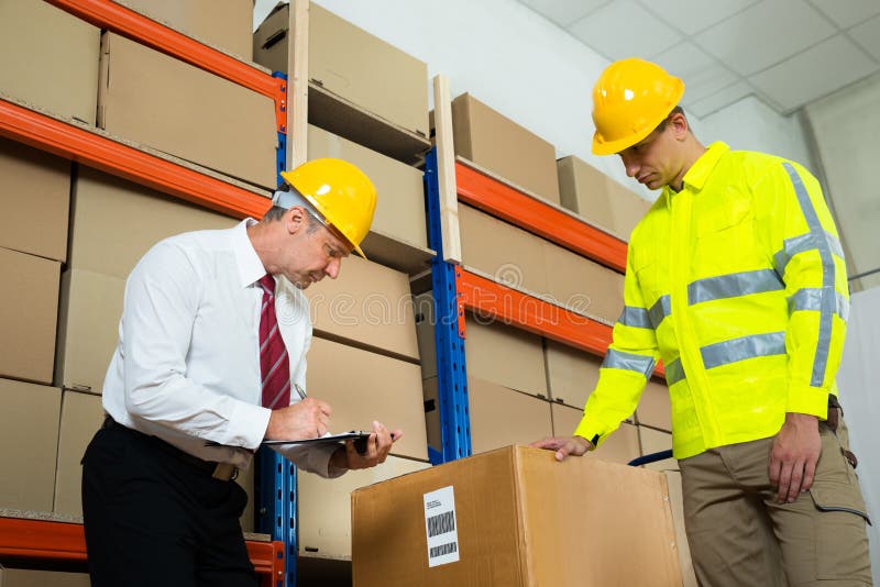 Manager Checking List with Worker in Warehouse Stock Image - Image of ...