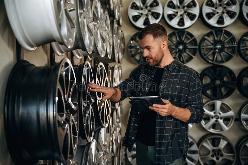 Manager is Checking the Product, with Digital Tablet. Man Worker is ...