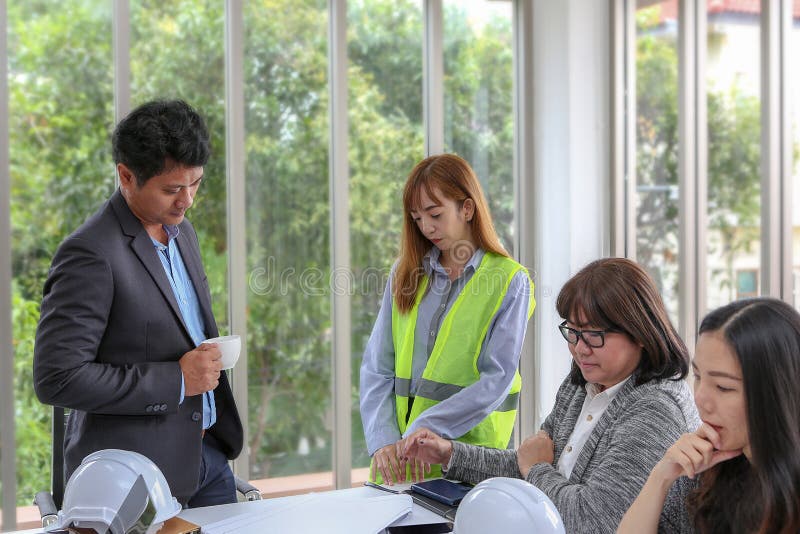 The Manager is Checking the Work of the Engineer Team. Planning Stock ...