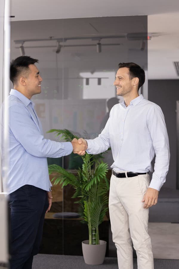 Manager and Client Shaking Hands Standing in Modern Office Stock Image - Image of shake ...