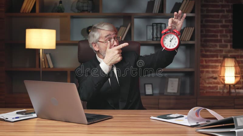 Manager with Clock Relishing about Break from Work in Office Stock ...