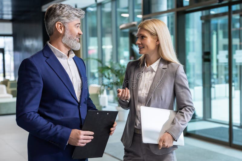 Manager and Colleague Standing Together in Corporate Space Stock Image ...