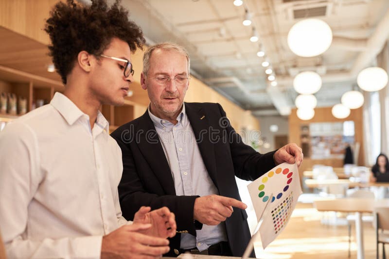 Manager with Color Palette and Creative Designer in the Office Stock ...