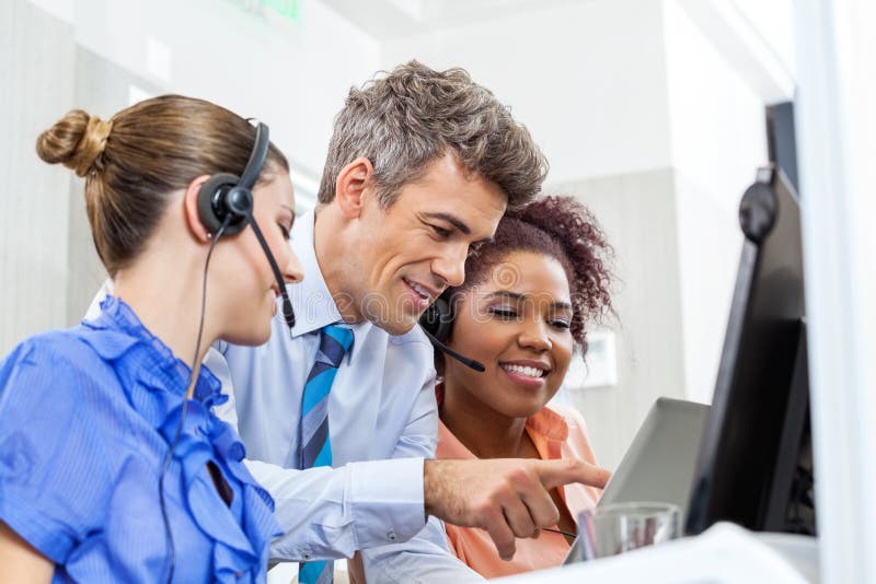 Manager with Customer Service Executives Using Stock Image - Image of ...