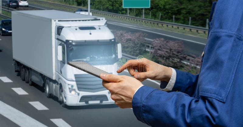 Manager with a Digital Tablet on the Background of Truck. Fleet ...