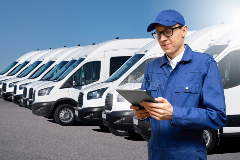 Manager with a Digital Tablet on the Background of Vans. Stock Photo ...