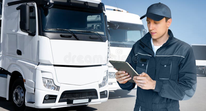 Manager with a Digital Tablet Next To Trucks. Stock Image - Image of ...