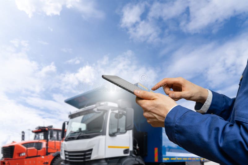 Manager with a Digital Tablet Next To Trucks. Fleet Management Stock ...
