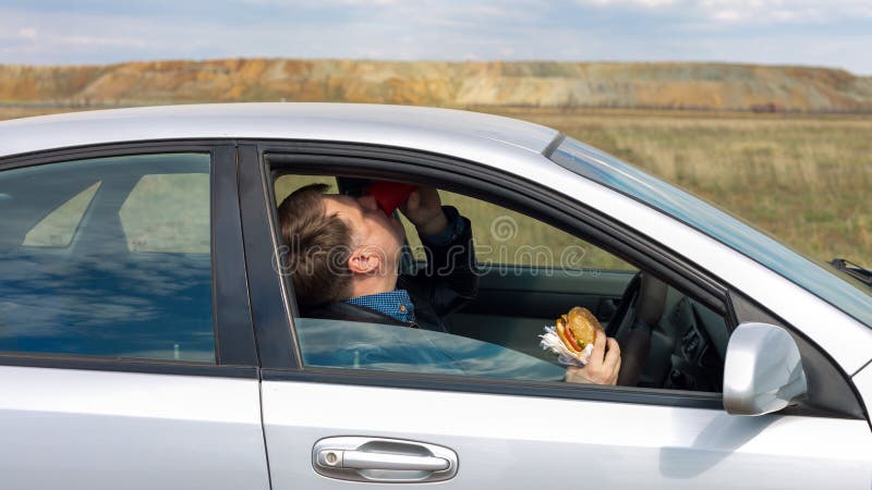 The Manager Eats Lunch at Wheel in the Car Stock Photo - Image of road ...