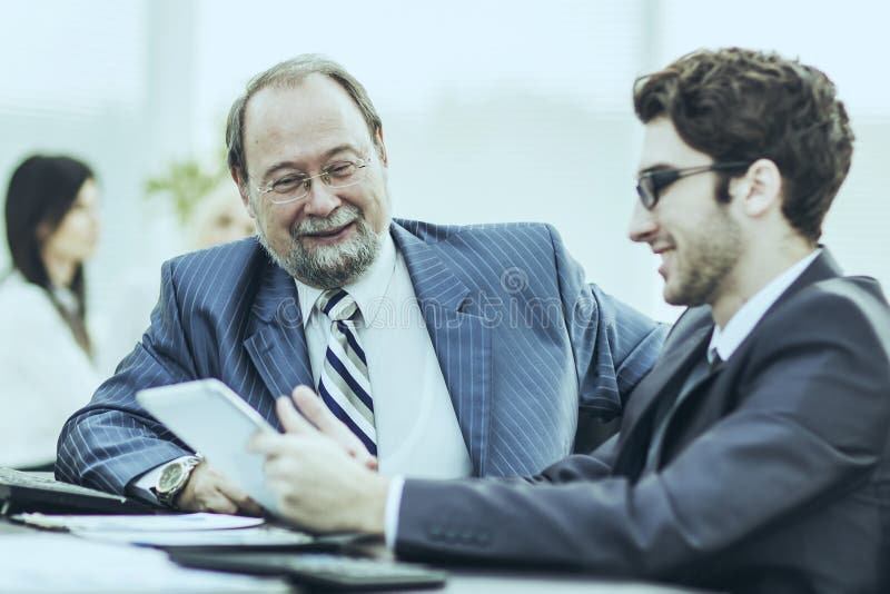 Members of a Business Team Discussing Business Documents in the ...