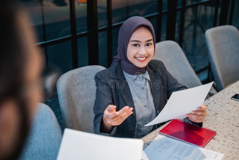 Manager and Employee Talking about the Document in the Office Stock ...