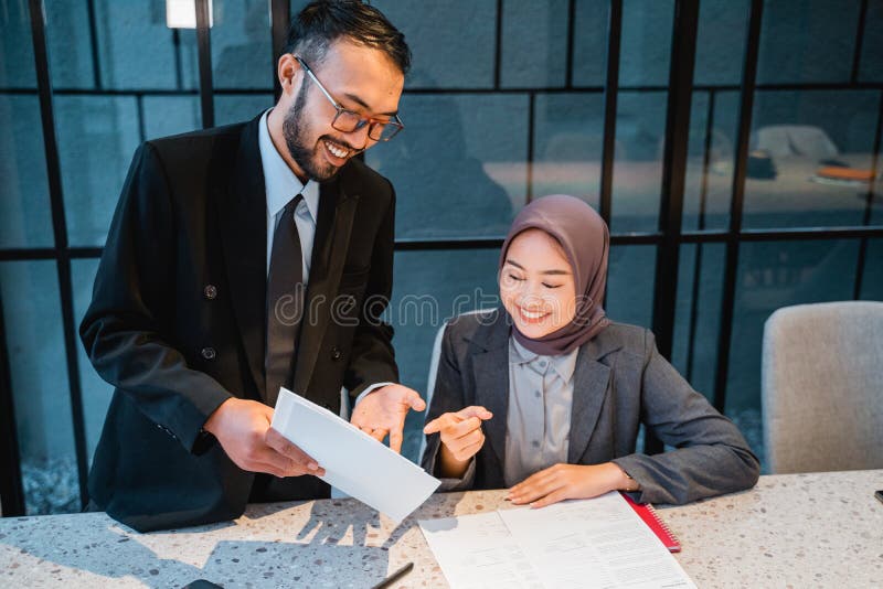 Manager and Employee Talking about the Document in the Office Together ...