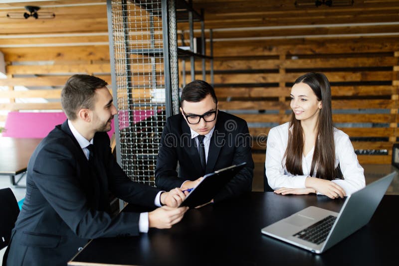 Manager Explain the Document Details To Young Couple. Stock Image ...