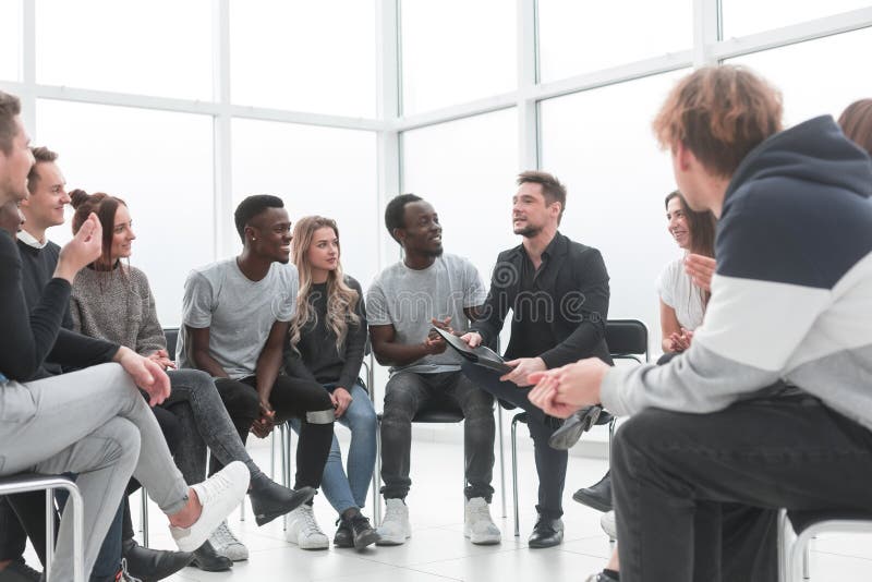 Manager Explaining Something To the Young Participants of the Project ...