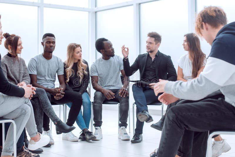 Manager Explaining Something To the Young Participants of the Project ...