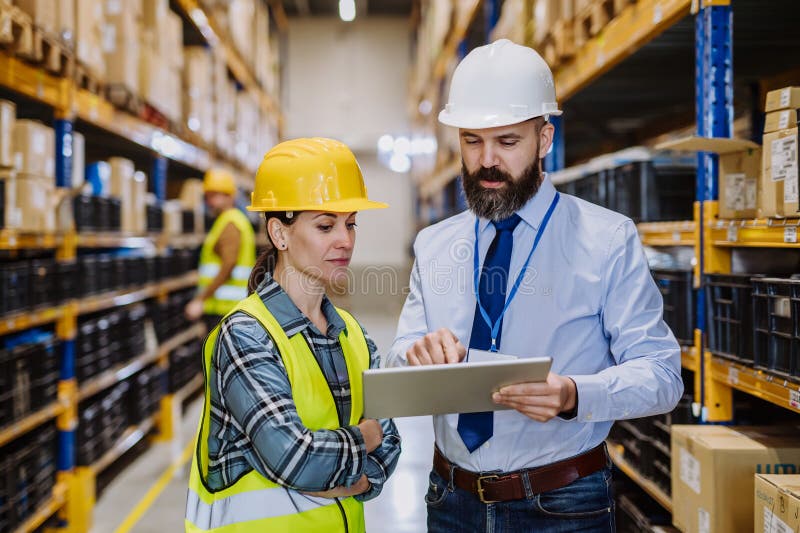 Manager Explaining Work To His Employers in Warehouse. Stock Image ...