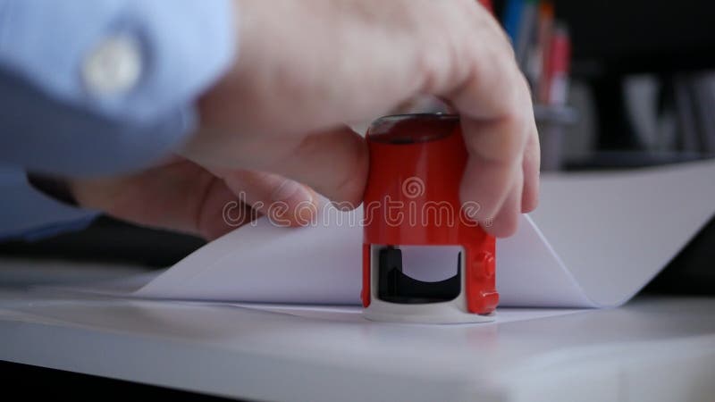 Manager Hand Stamping Papers and Documents Using a Rubber Stamp Stock ...
