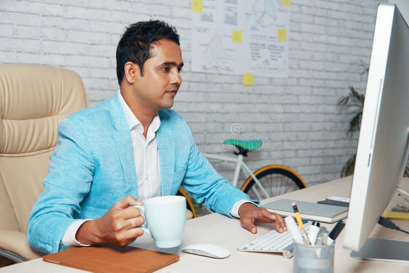 Manager Having Coffee at Work Stock Image - Image of holding, person ...