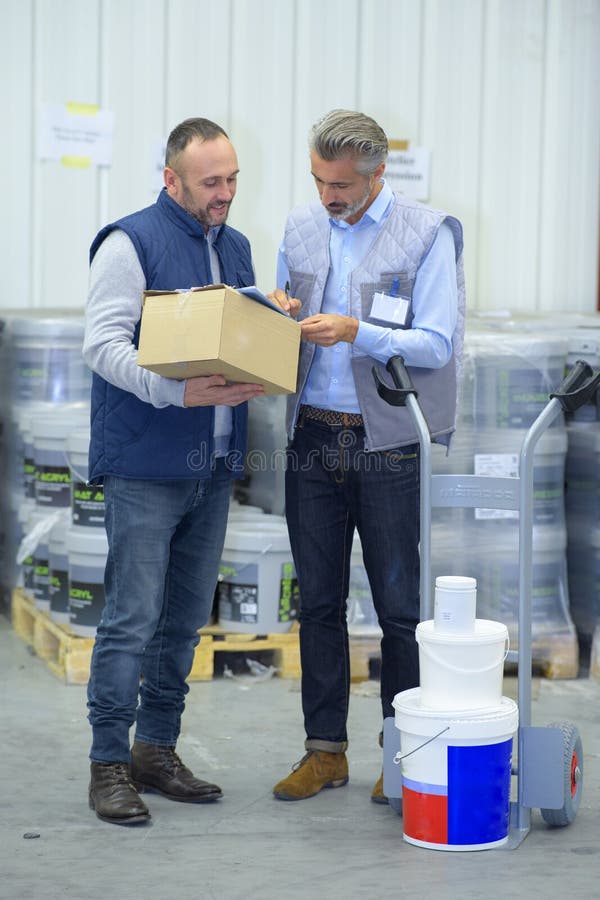 Manager Holding Box Outside Warehouse Stock Image - Image of industry ...