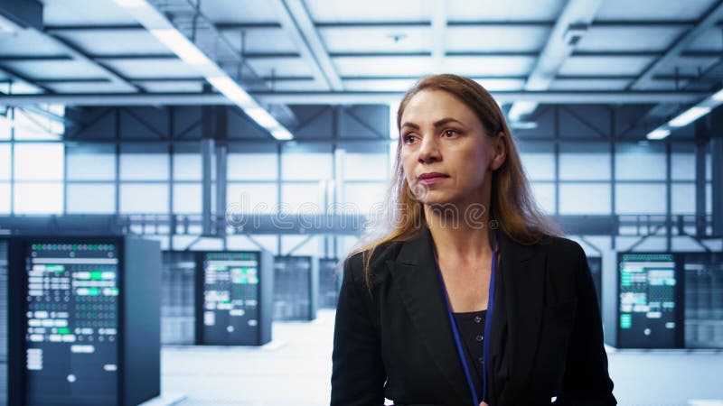 Manager Inspecting Server Room Equipment, Walking between ...