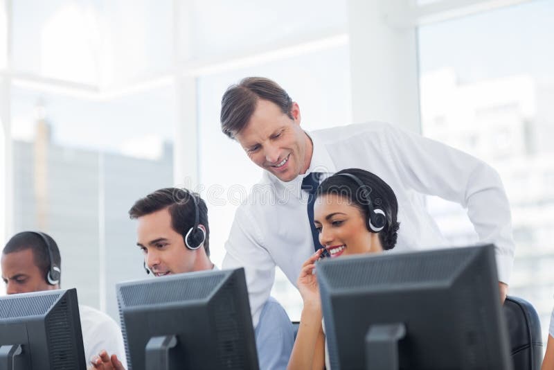 Manager Listening To Call Centre Employee Stock Image - Image of centre ...