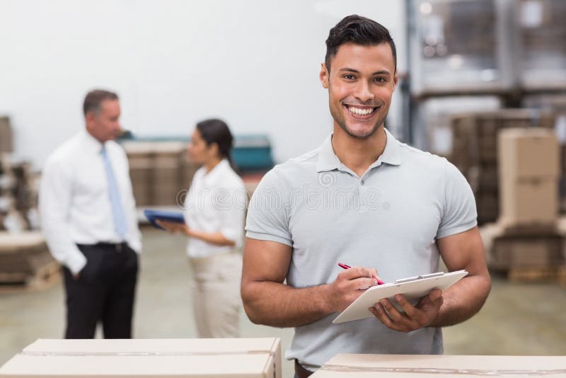 Manager Looking at Camera while Holding Clipboard Stock Image - Image ...