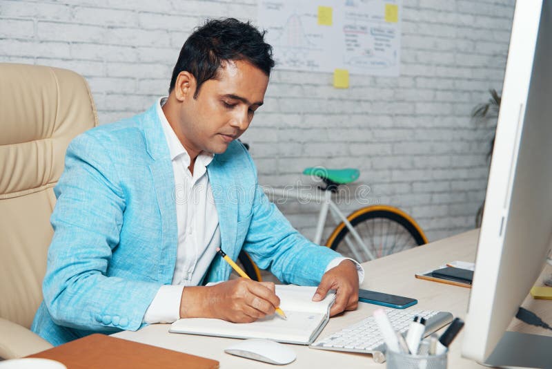 Manager Making Notes in Notepad at Office Stock Image - Image of ...
