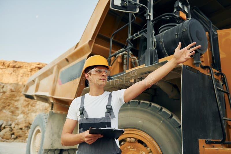 Manager Planning the Work. Man in Professional Uniform is on the Borrow ...
