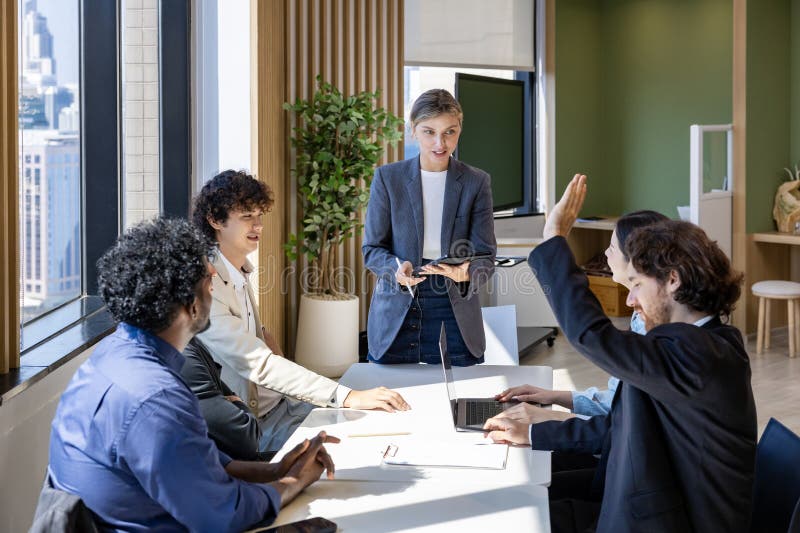 Manager is Presenting New Project To the Team while Having Question ...