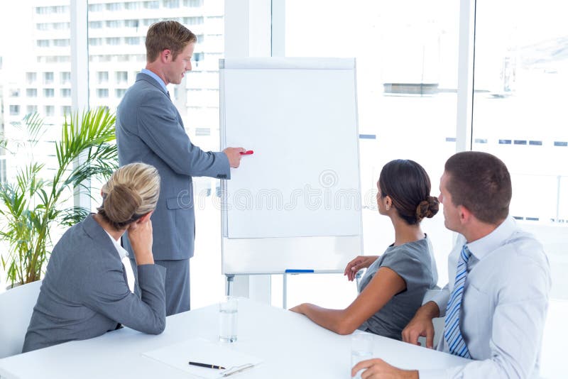 Manager Presenting Whiteboard To His Colleagues Stock Photo - Image of ...
