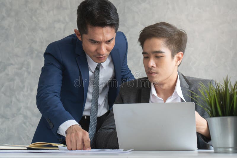 Manager Reviewing Work of Intern Worker Stock Image - Image of ...