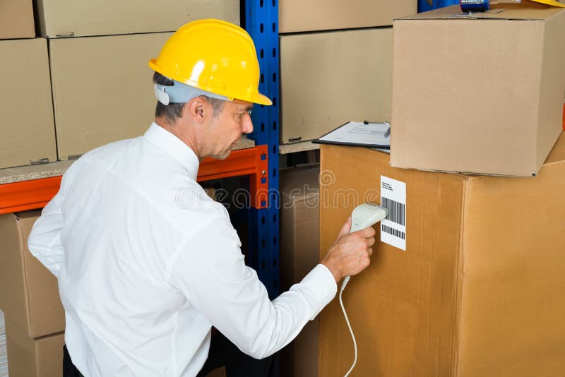Delivery Man Scanning Cardboard Boxes with Barcode Scanner Stock Photo ...
