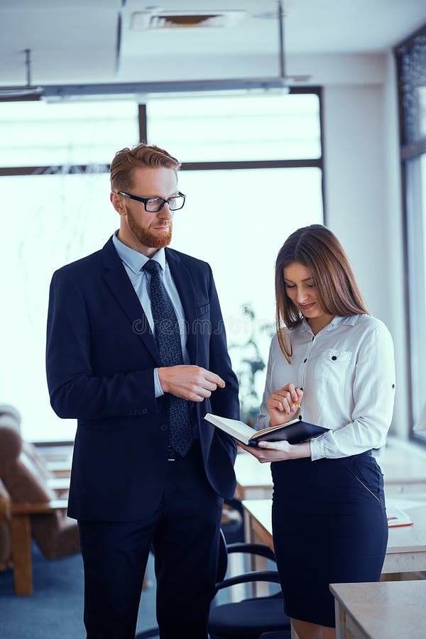 Manager and Secretary with Notepad in the Office Stock Photo - Image of ...