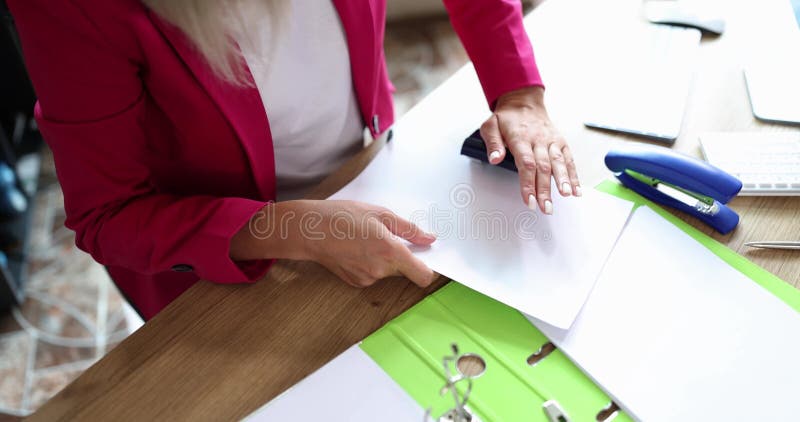 Manager Secretary Punch Holes with Puncher in Documents in Office Stock ...