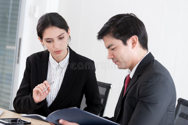 A Manager and Secretary Working Together in the Office Stock Photo ...