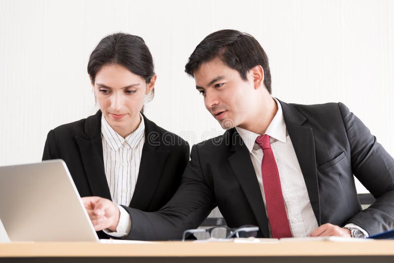 A Manager and Secretary Working Together in the Office Stock Photo ...