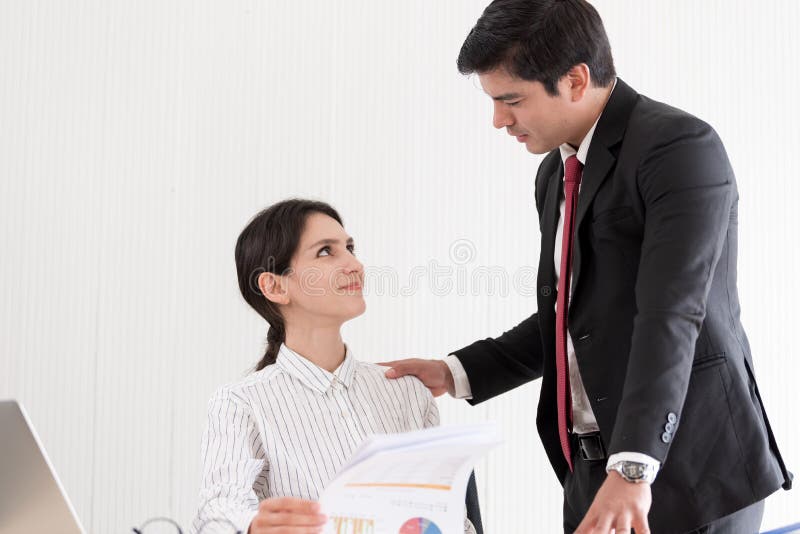 A Manager and Secretary Working Together in the Office Stock Photo ...