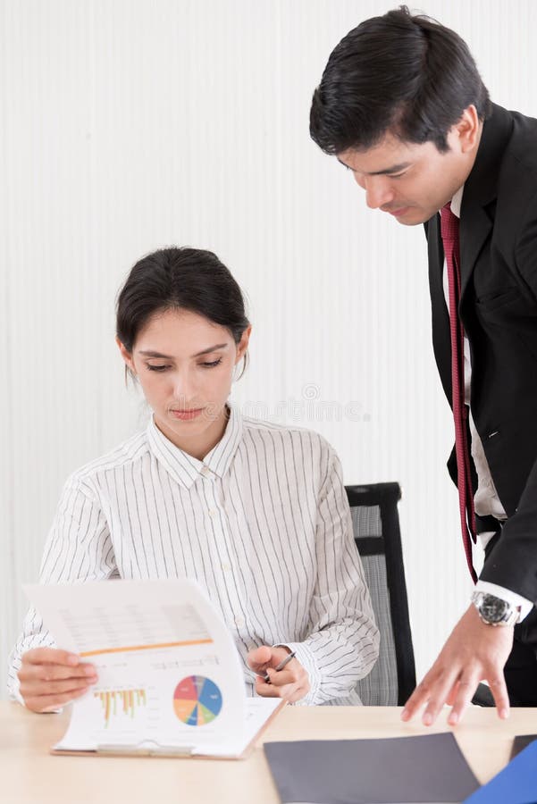 A Manager and Secretary Working Together in the Office Stock Image ...