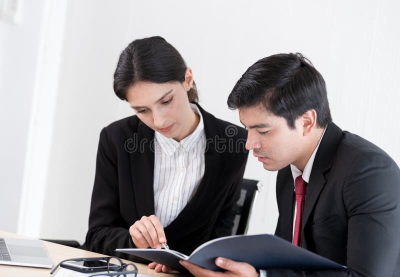 A Manager and Secretary Working Together in the Office Stock Image ...