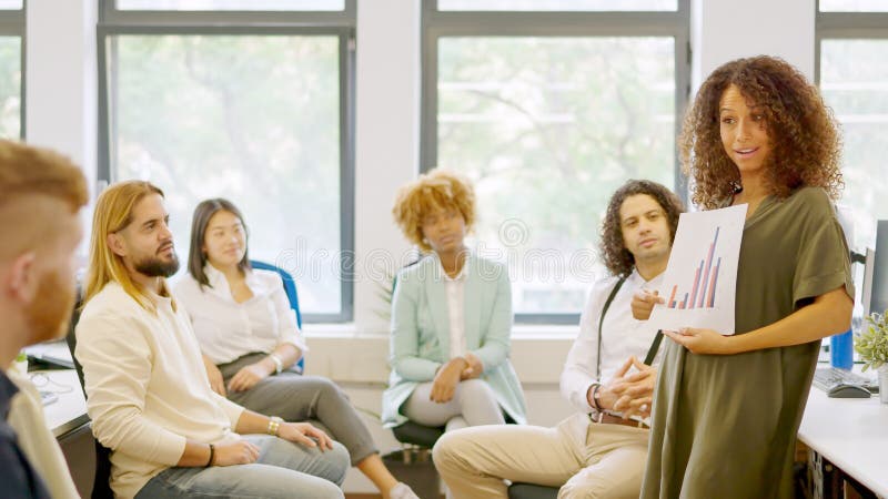 Manager Showing Data Using Graphics during a Meeting Stock Image ...