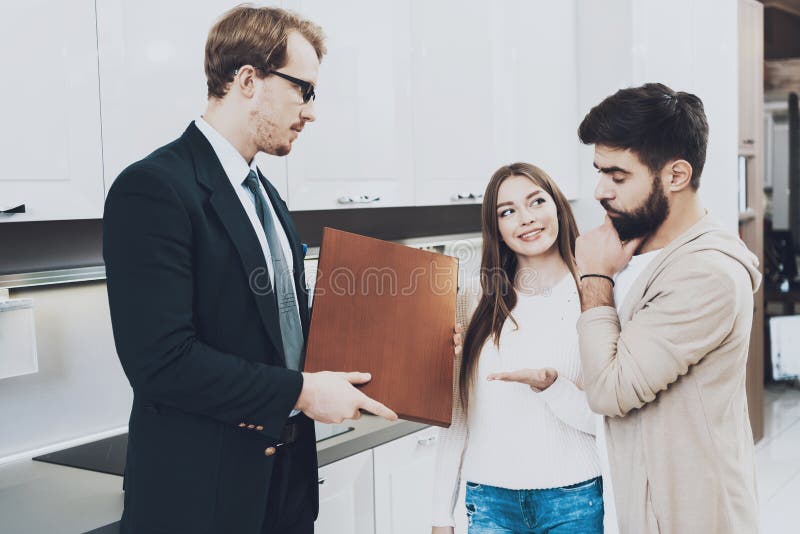 The Manager Holds the Material for New Kitchen. Stock Photo - Image of ...