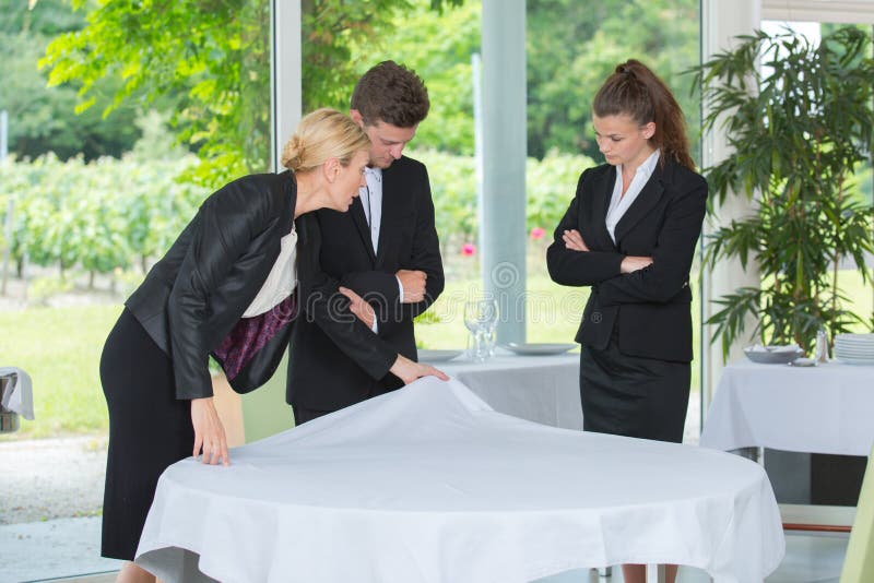 Manager Showing Workers How To Set Up Table Stock Image - Image of ...