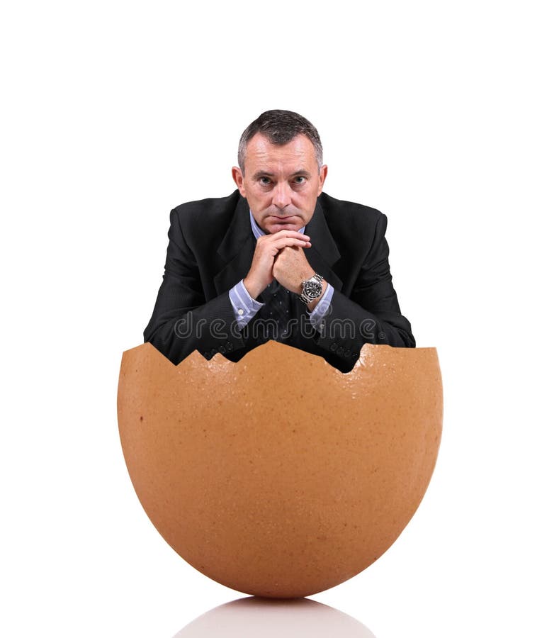 Man sitting into a egg stock photo. Image of concept - 101468924