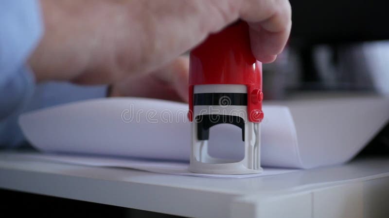 Manager Stamping Some Papers and Documents Using a Rubber Stamp in Slow ...