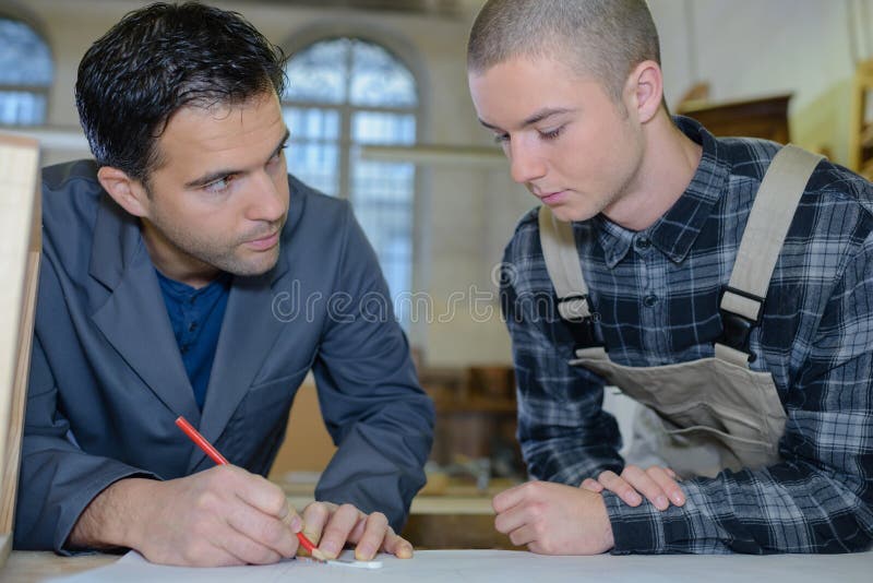 Manager Supervising Work Apprentice Stock Photo - Image of meeting ...