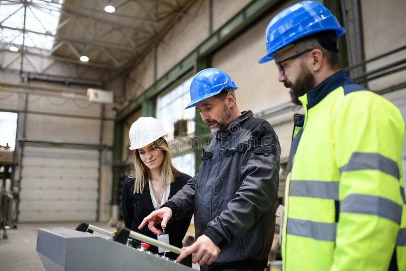 Manager Supervisors and Industrial Worker in Uniform Doing Control in ...