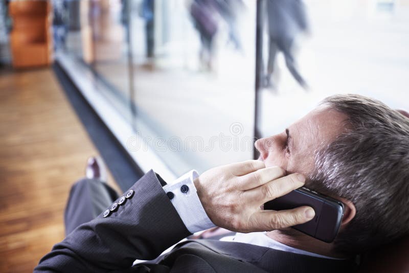 Manager Talking on Phone, People in Background. Stock Image - Image of ...