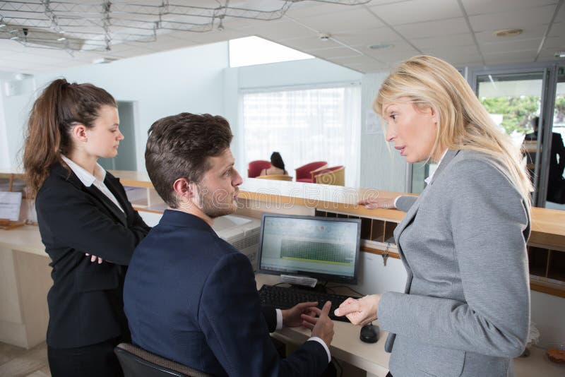 Receptionist Talking To Client while Making Photocopies Stock Image ...