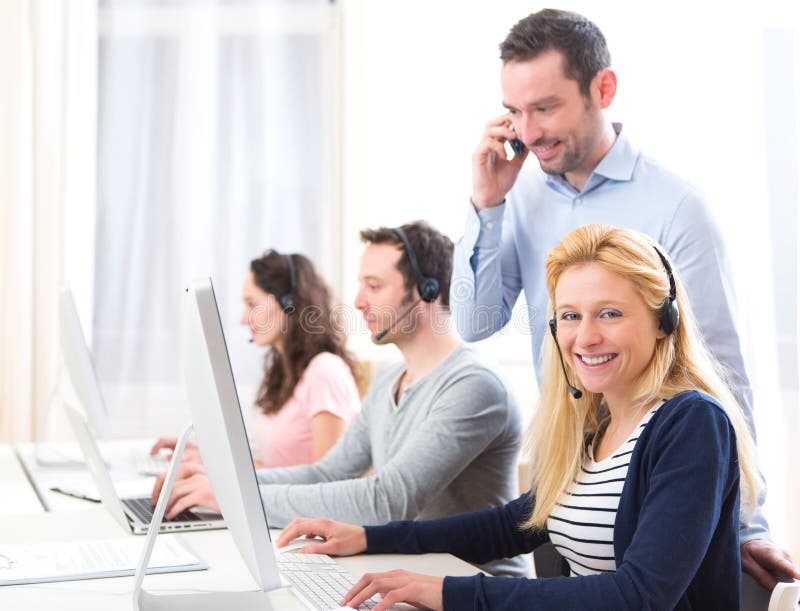 Manager Training a Young Attractive People on Computer Stock Photo ...