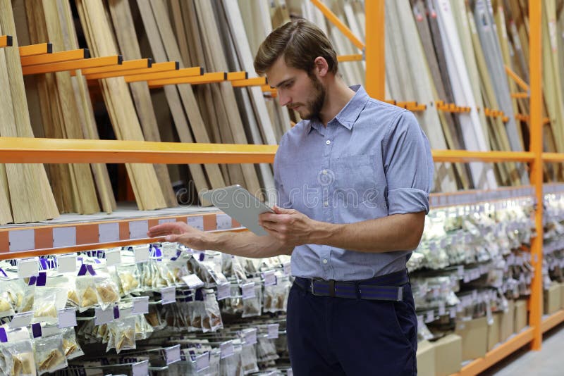 Manager Use His Tablet for Online Checking Products Available Stock ...